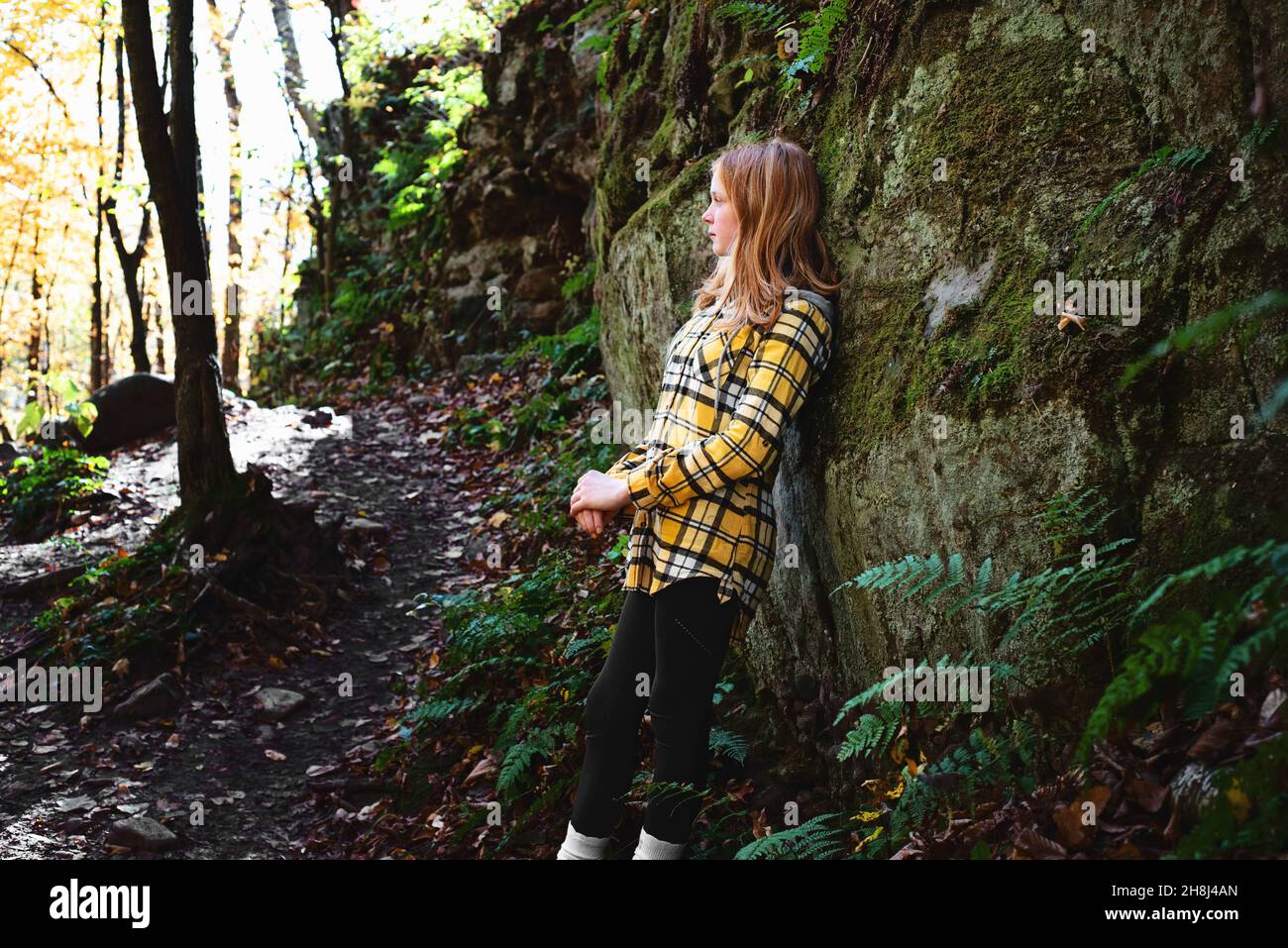 Red Haired Tween Girl Hiking in the Fall woods Stock Photo - Alamy