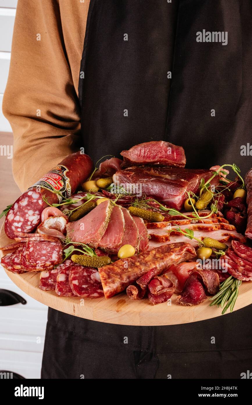 homemade dried meat on a background with vegetables Stock Photo - Alamy