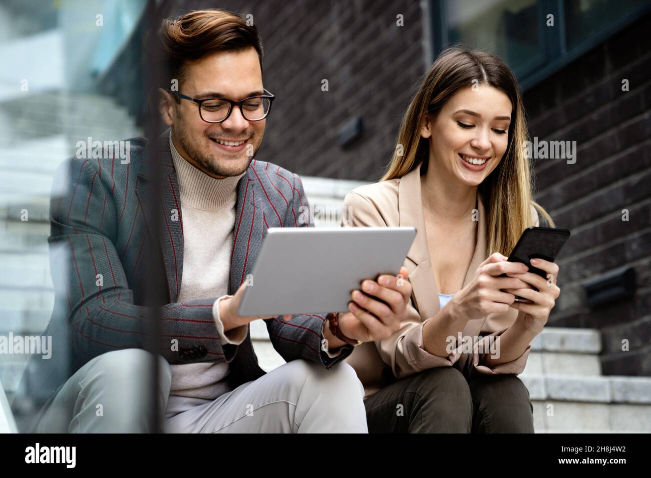 Successful business colleagues people working together on digital ...