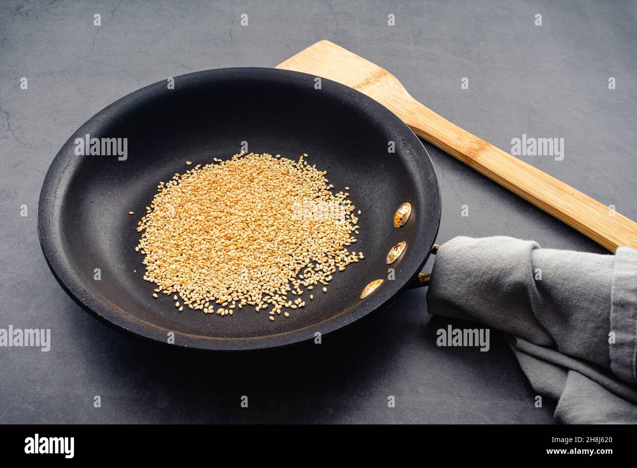 Toasted Sesame Seeds in a Small Skillet: Sesame seeds that have been ...