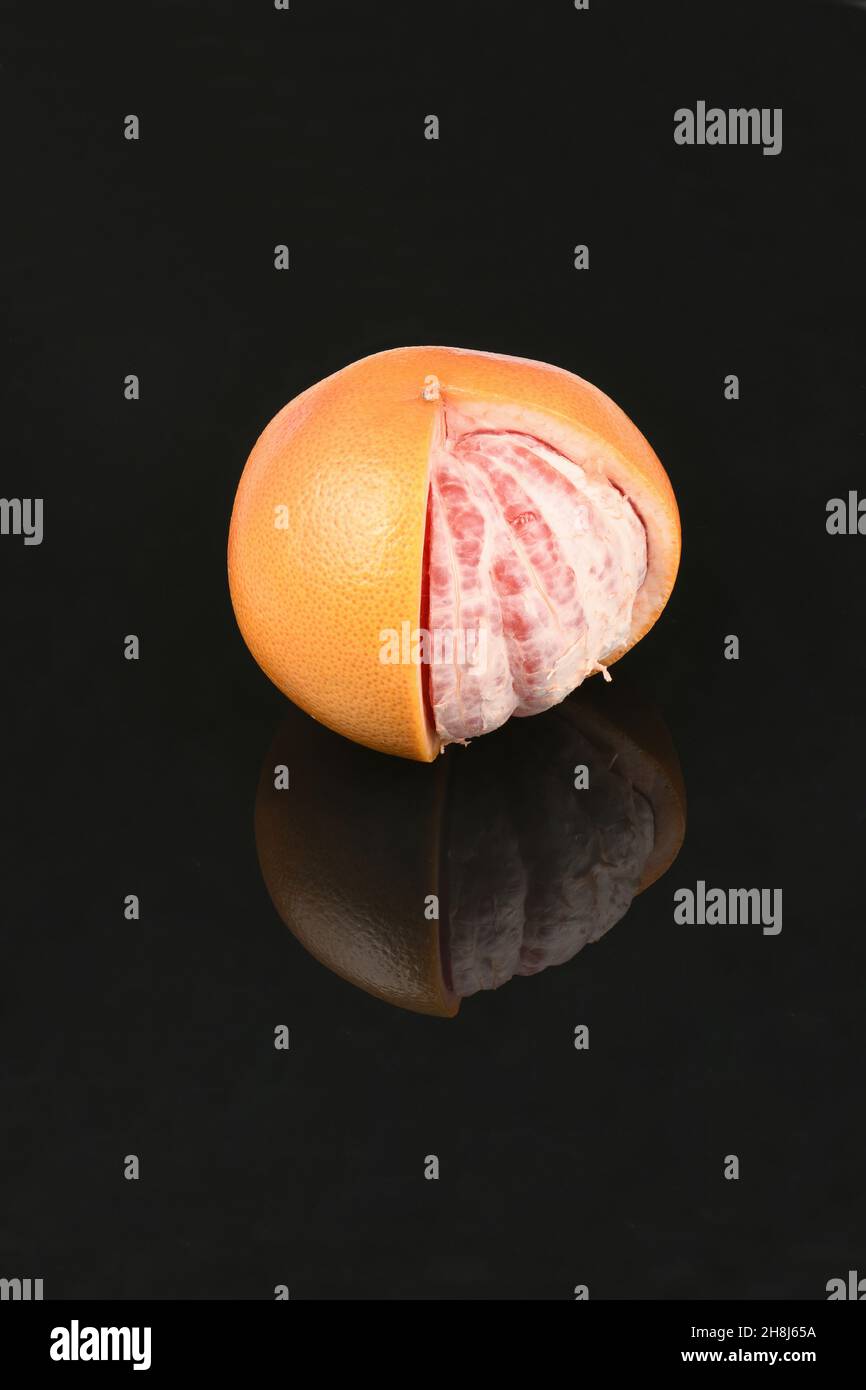 Grapefruit isolated on acrylic black background. High resolution photo ...