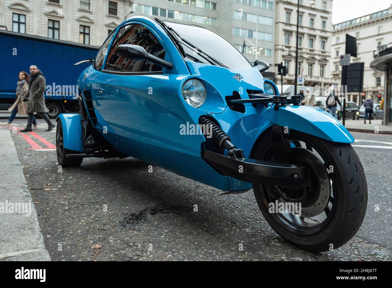 London, UK. 30 November 2021. People pass an eye-catching Carver One ...