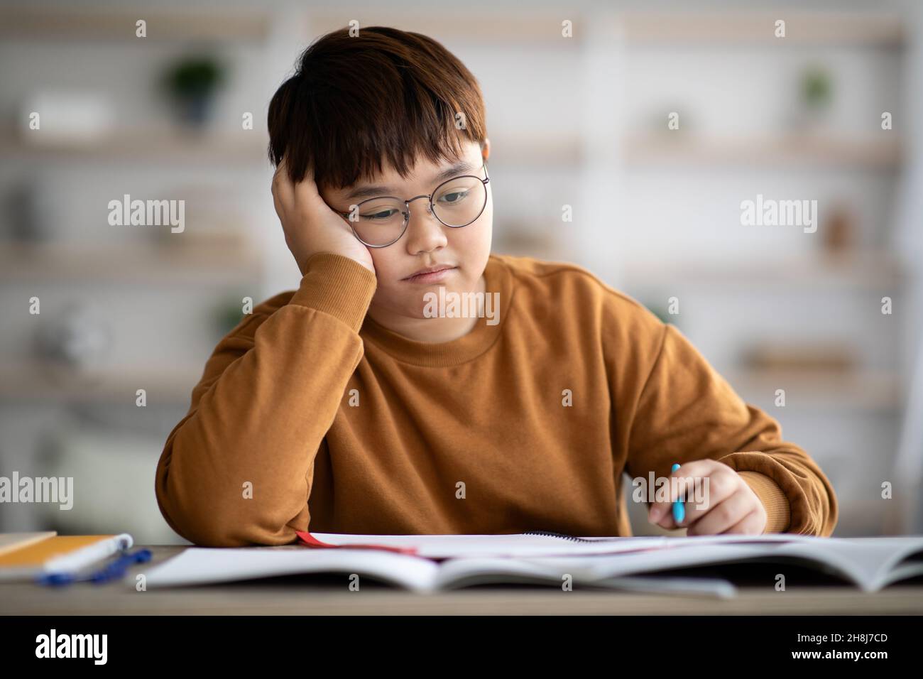 Schooler doing homework hi-res stock photography and images - Alamy