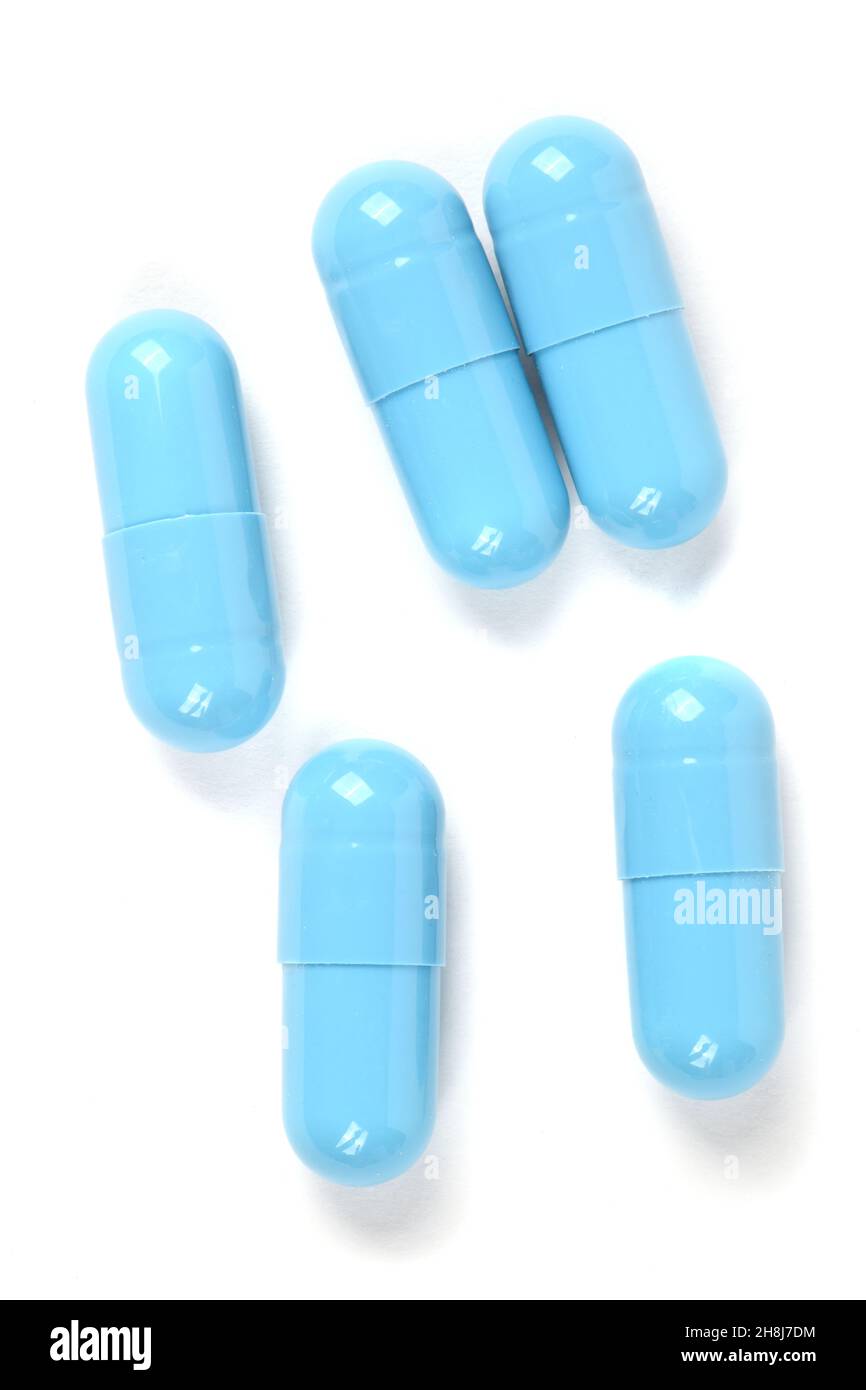 Blue medical capsules pill on white background. High resolution photo ...