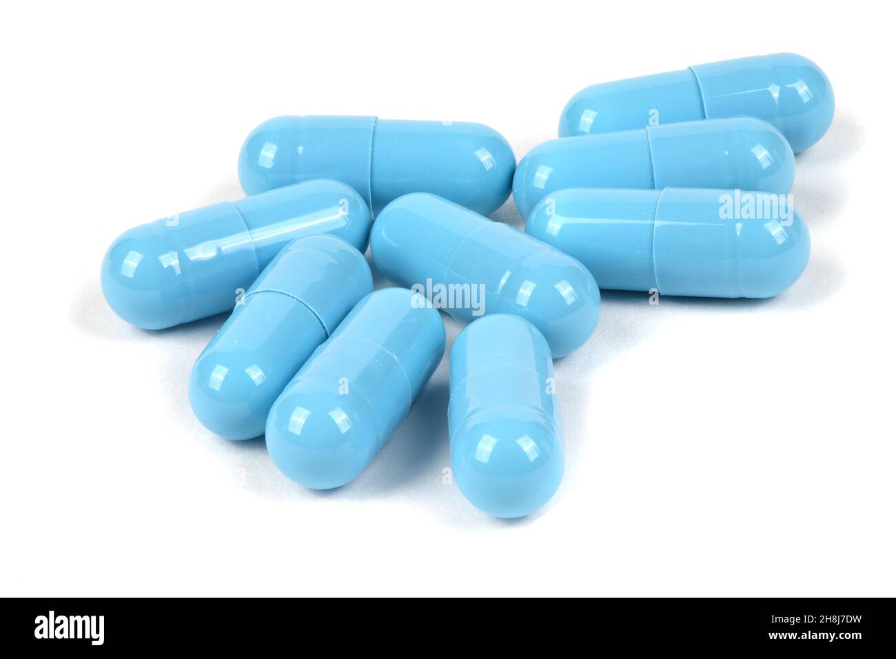 Blue medical capsules pill on white background. High resolution photo ...