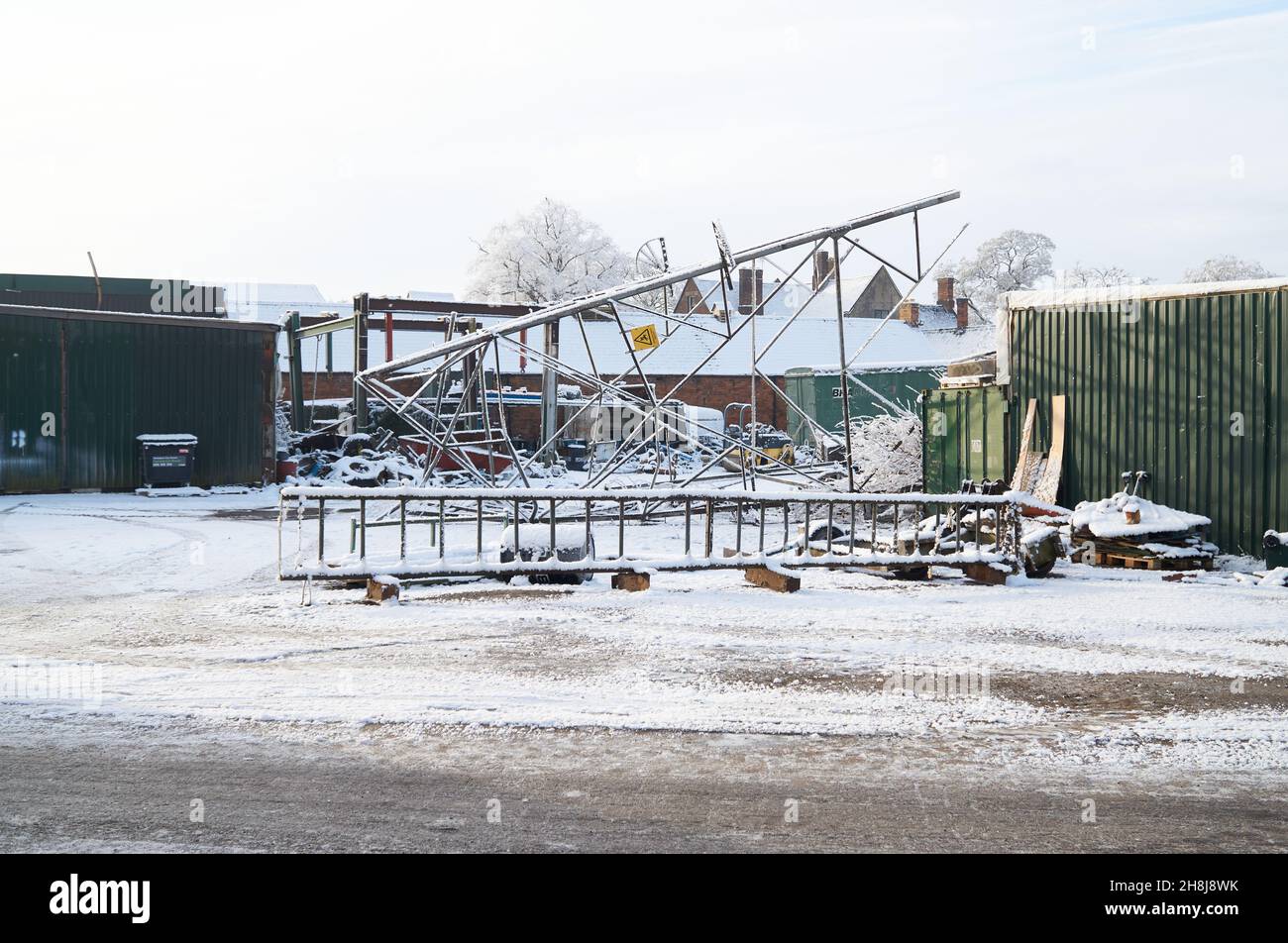 Scrap metal covered in snow Stock Photo - Alamy