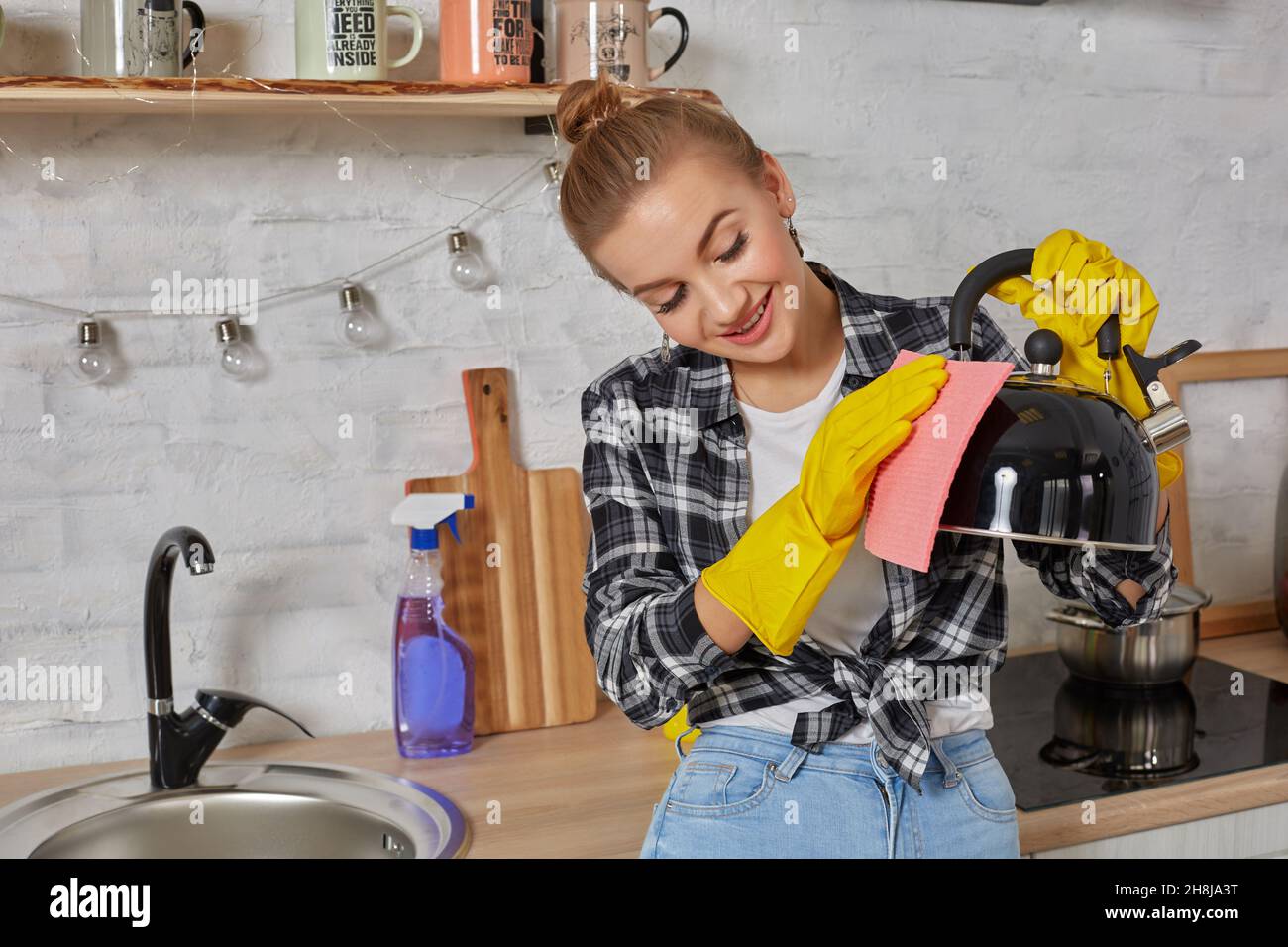 Domestic service and housekeeping concept, happy blonde lady cleaning ...