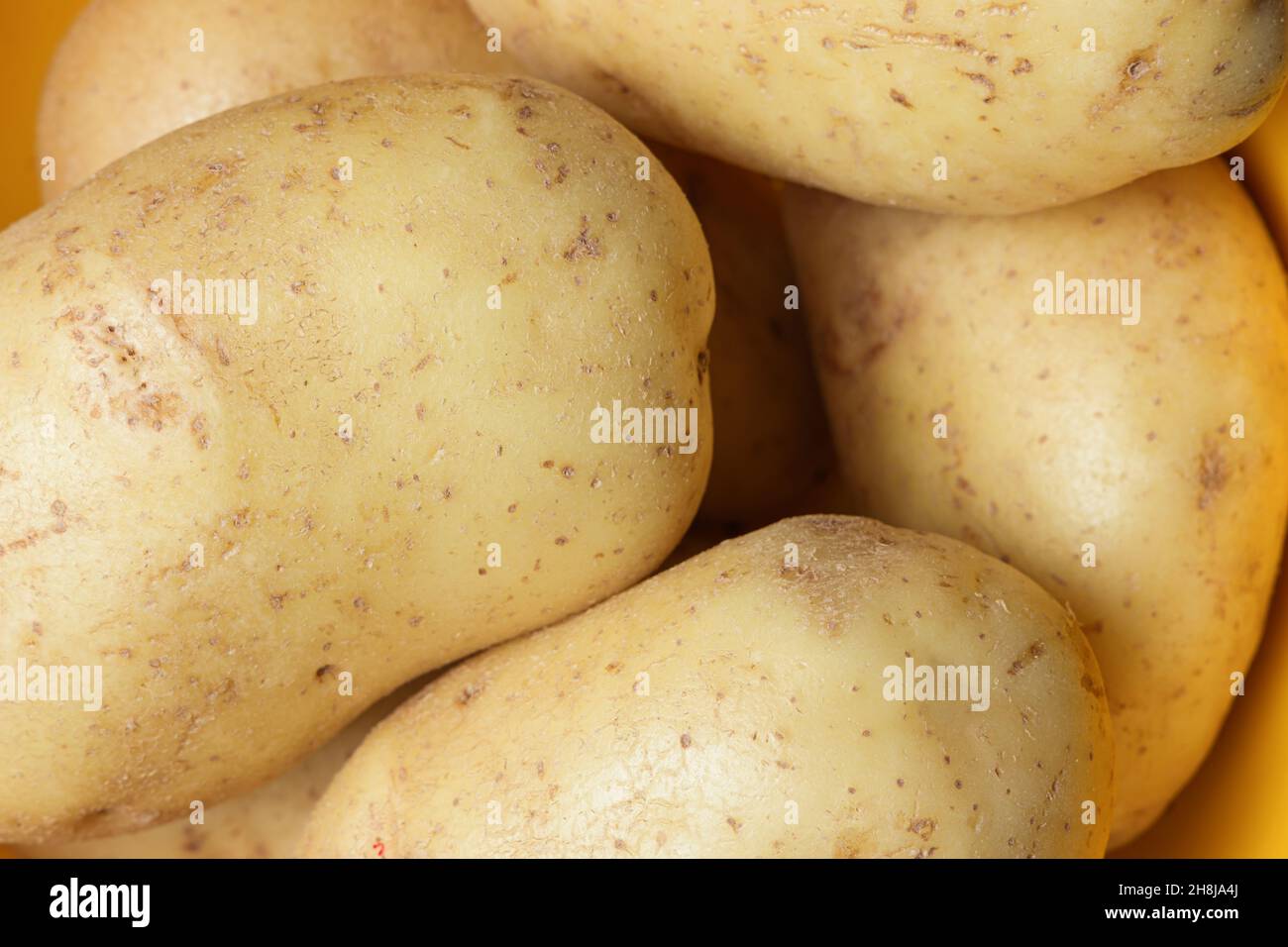 Pile of potatoes as background. Food texture Stock Photo - Alamy