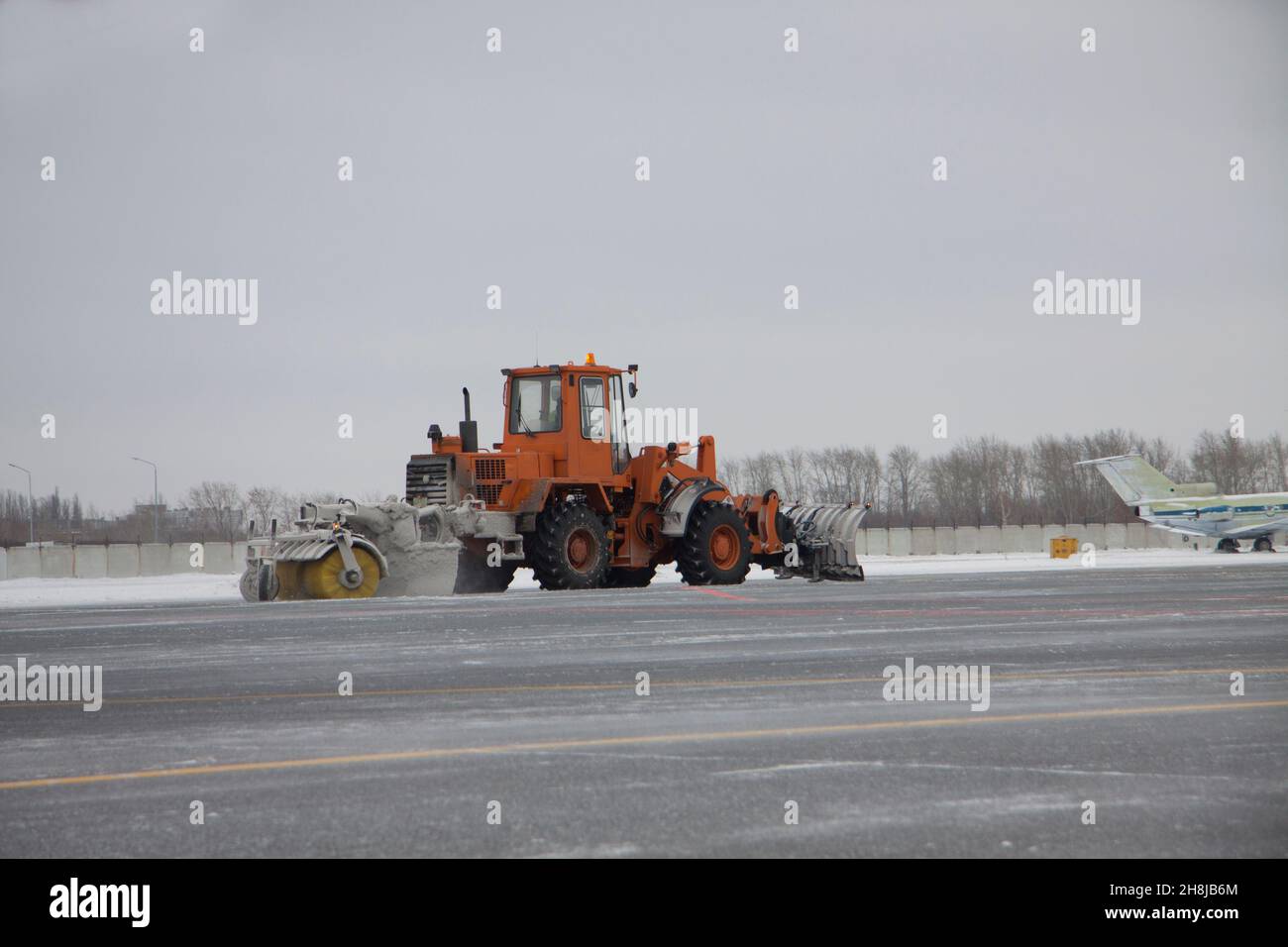 snow cutter working on the flying field of an airport Stock Photo - Alamy