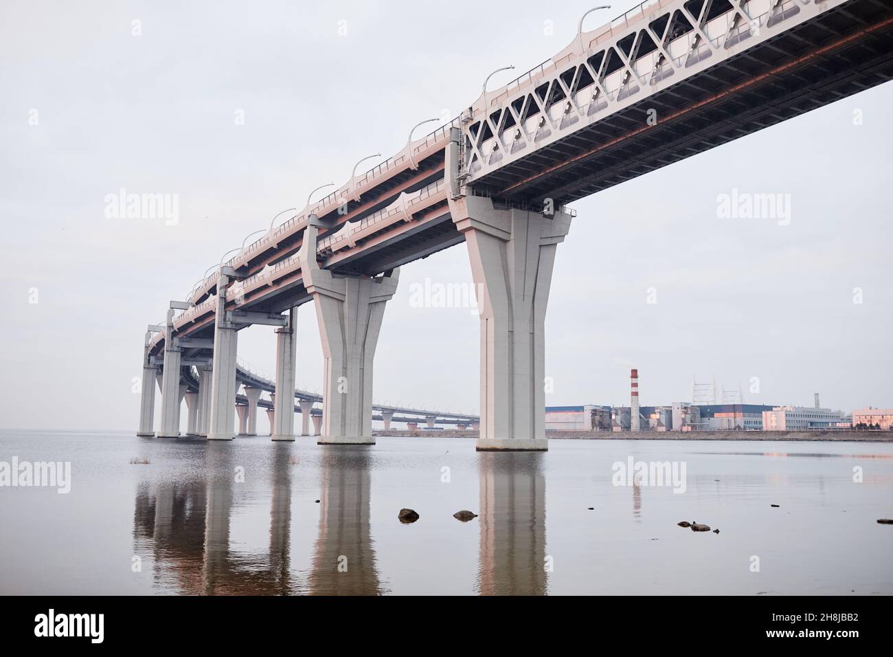 Wide angle view at high bridge in water at industrial production site ...