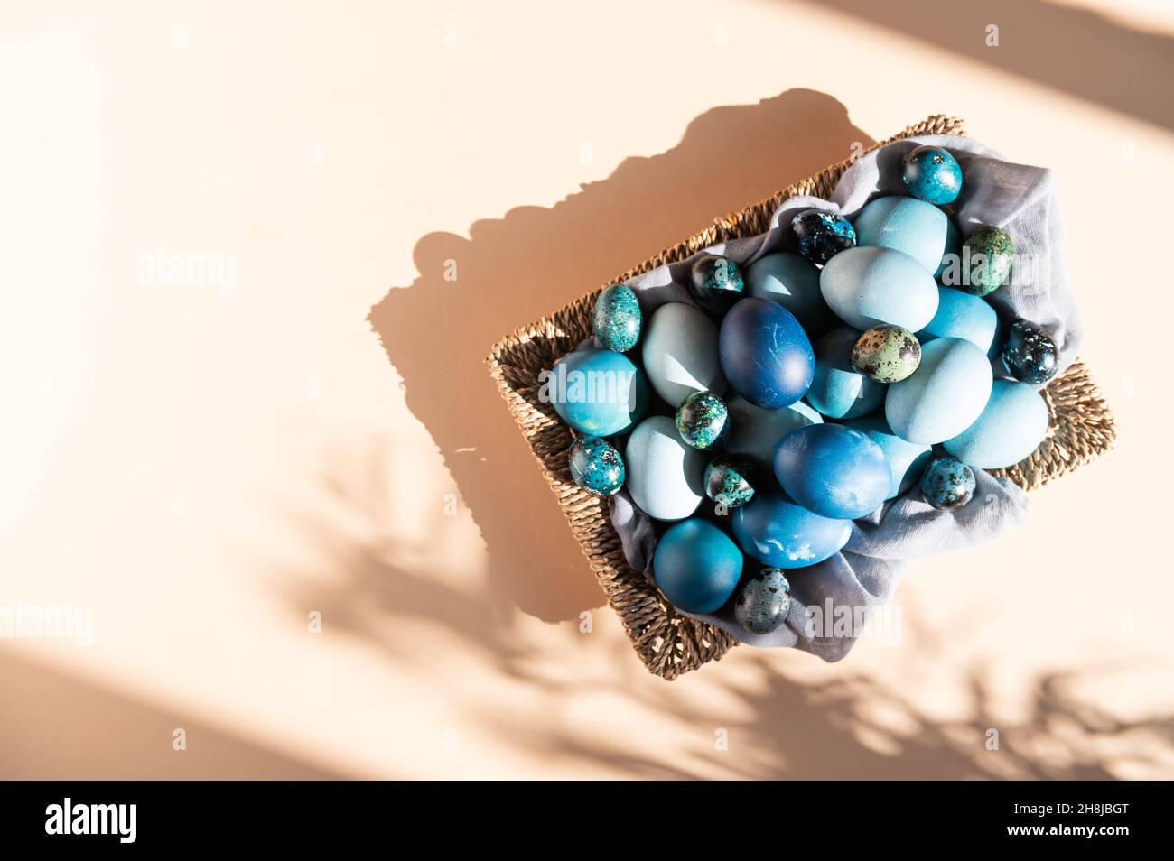 Homemade naturally dyed eggs in blue colors Stock Photo - Alamy