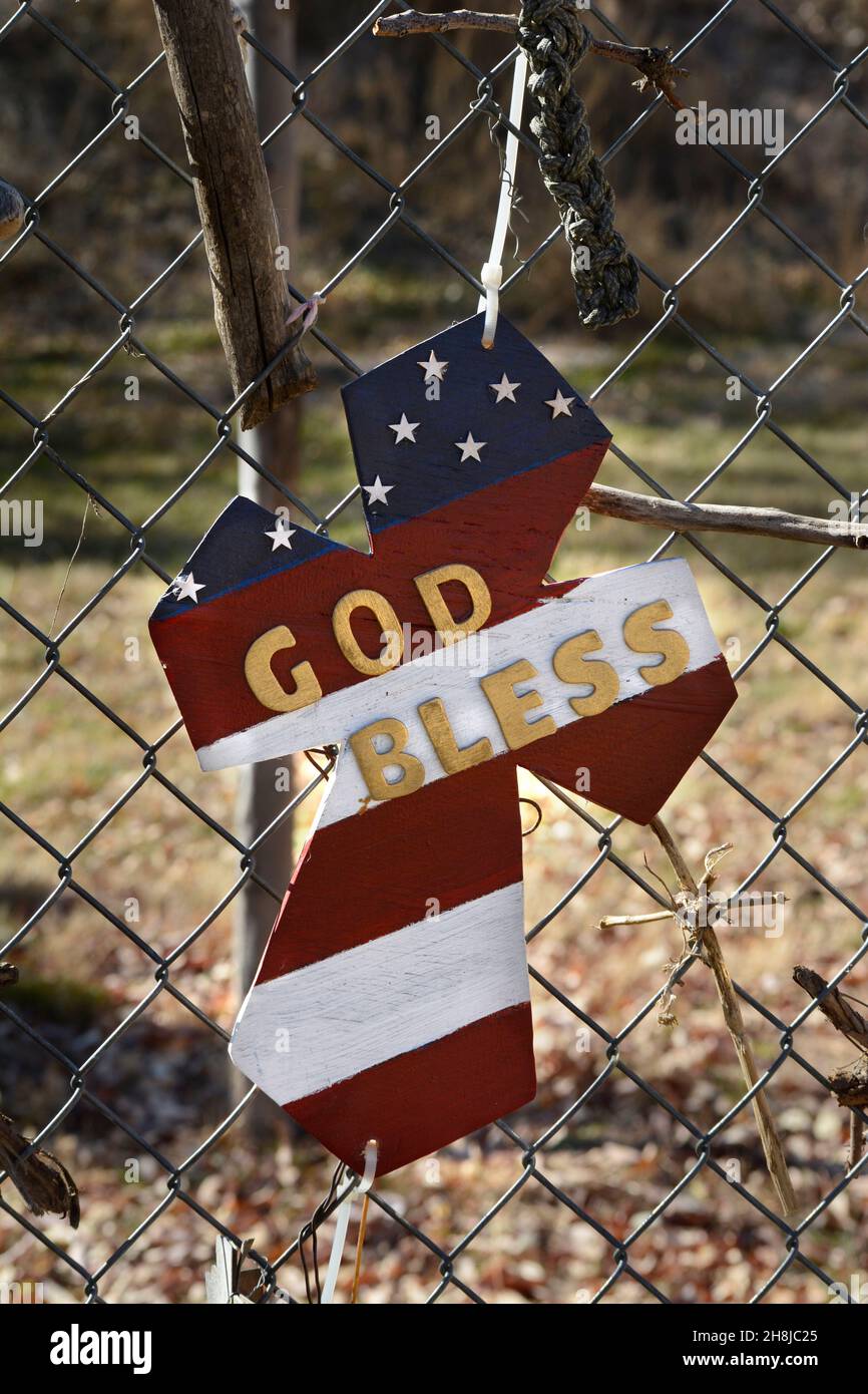 A handmade "God Bless" sign left by a visitor on a fence at the ...
