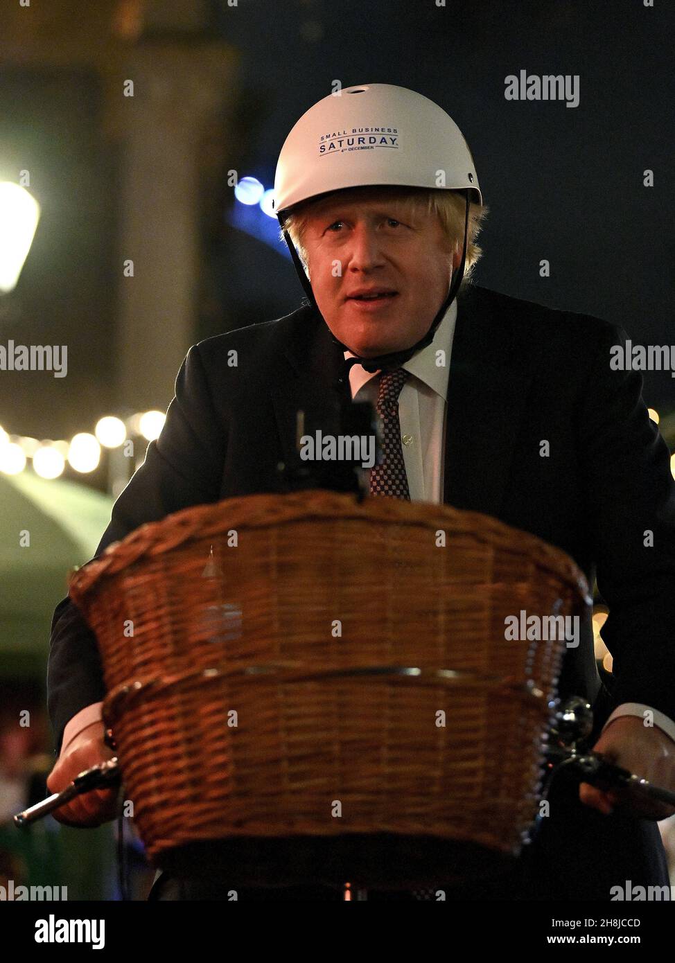 Prime Minister Boris Johnson riding a bicycle as he visits a UK Food ...