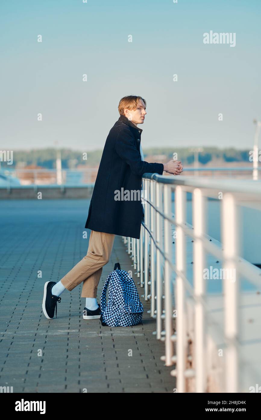 Old man leaning railings hi-res stock photography and images - Alamy