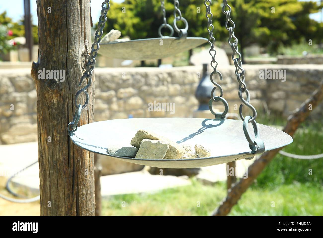 Azerbaijan Baku : 14.05.2021 . Ancient iron scales . wooden ancient ...