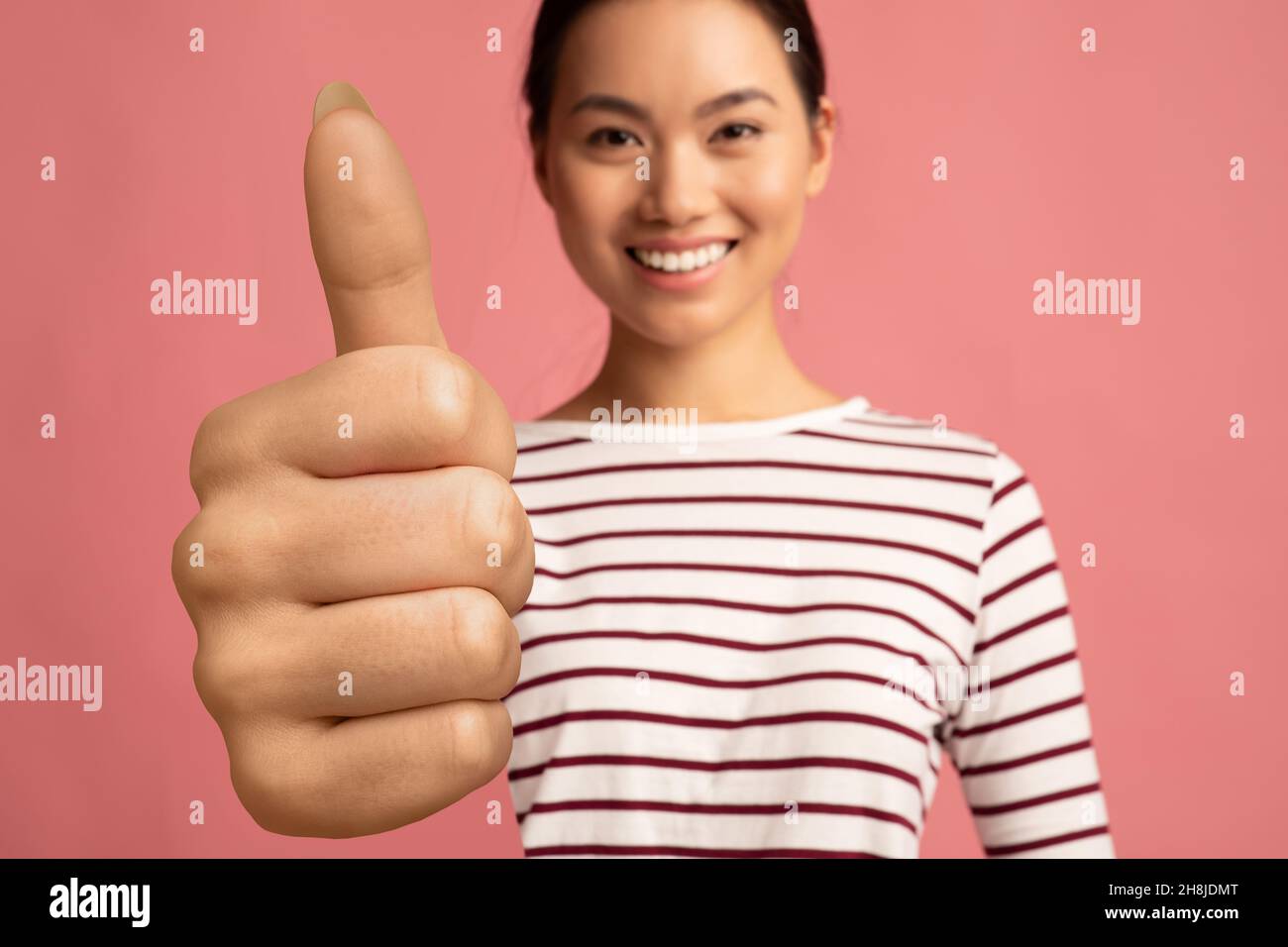 Closeup Of Smiling Asian Woman Showing Thumb Up Stock Photo - Alamy