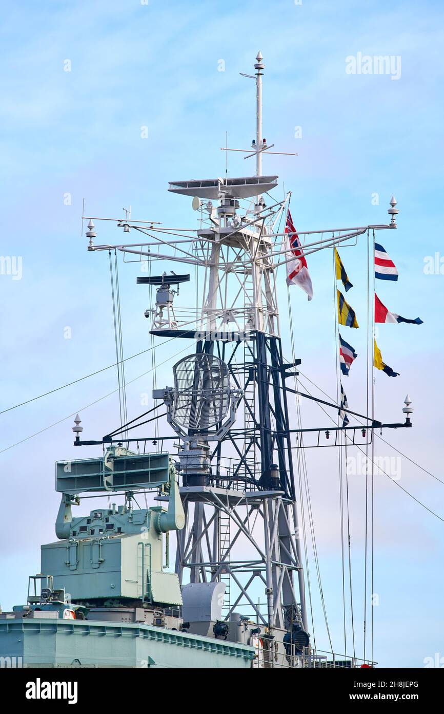 Radar mast with flags on HMS Belfast, a light crusier war ship, now a ...