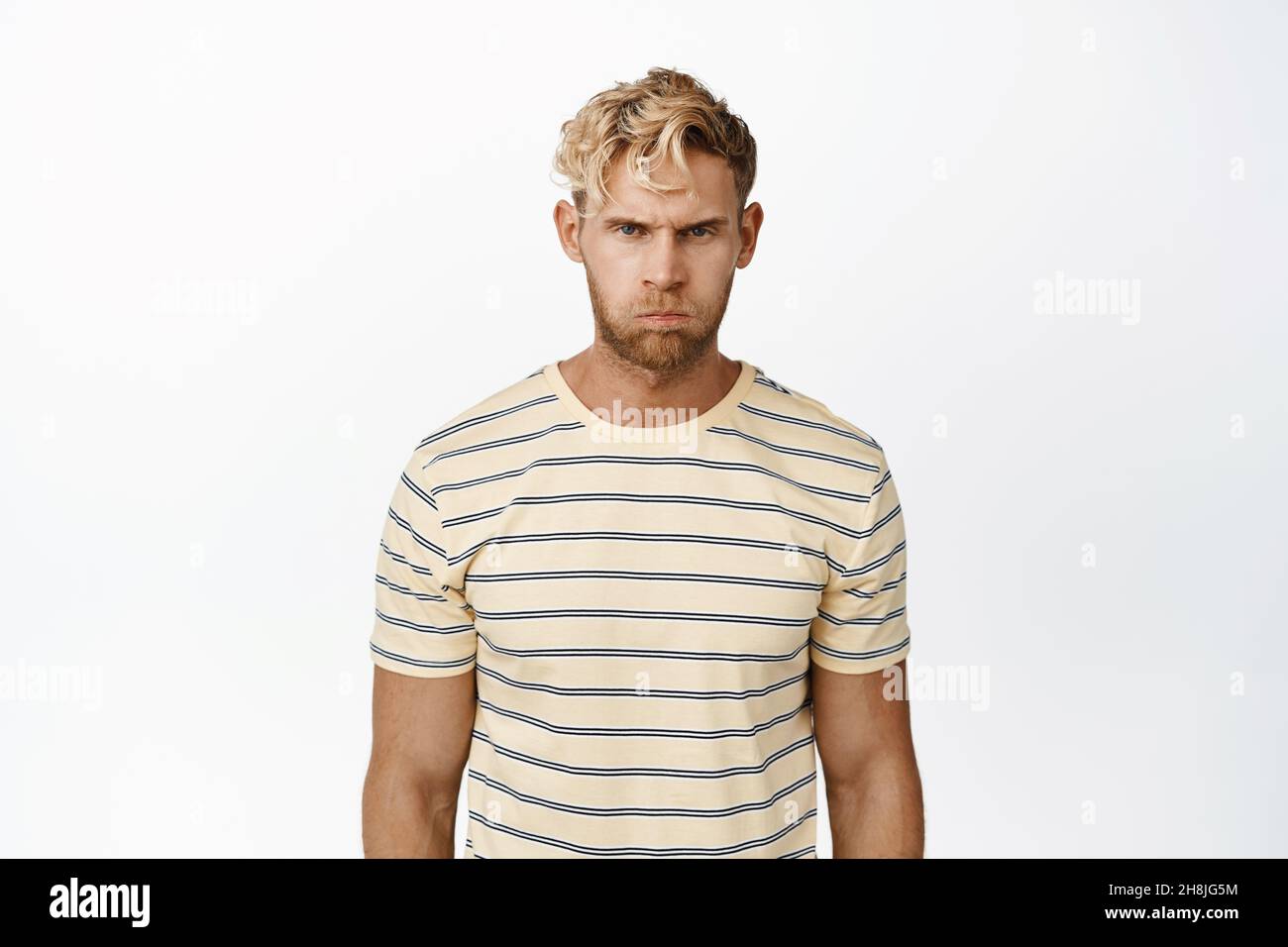 Portrait of guy sulking, furrow eyebrows angry, making upset pouting ...