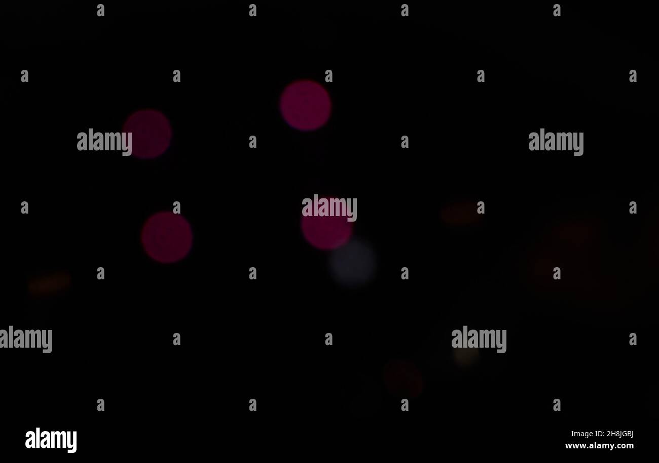 Slightly blurred purple orbs on dark purple background Stock Photo - Alamy
