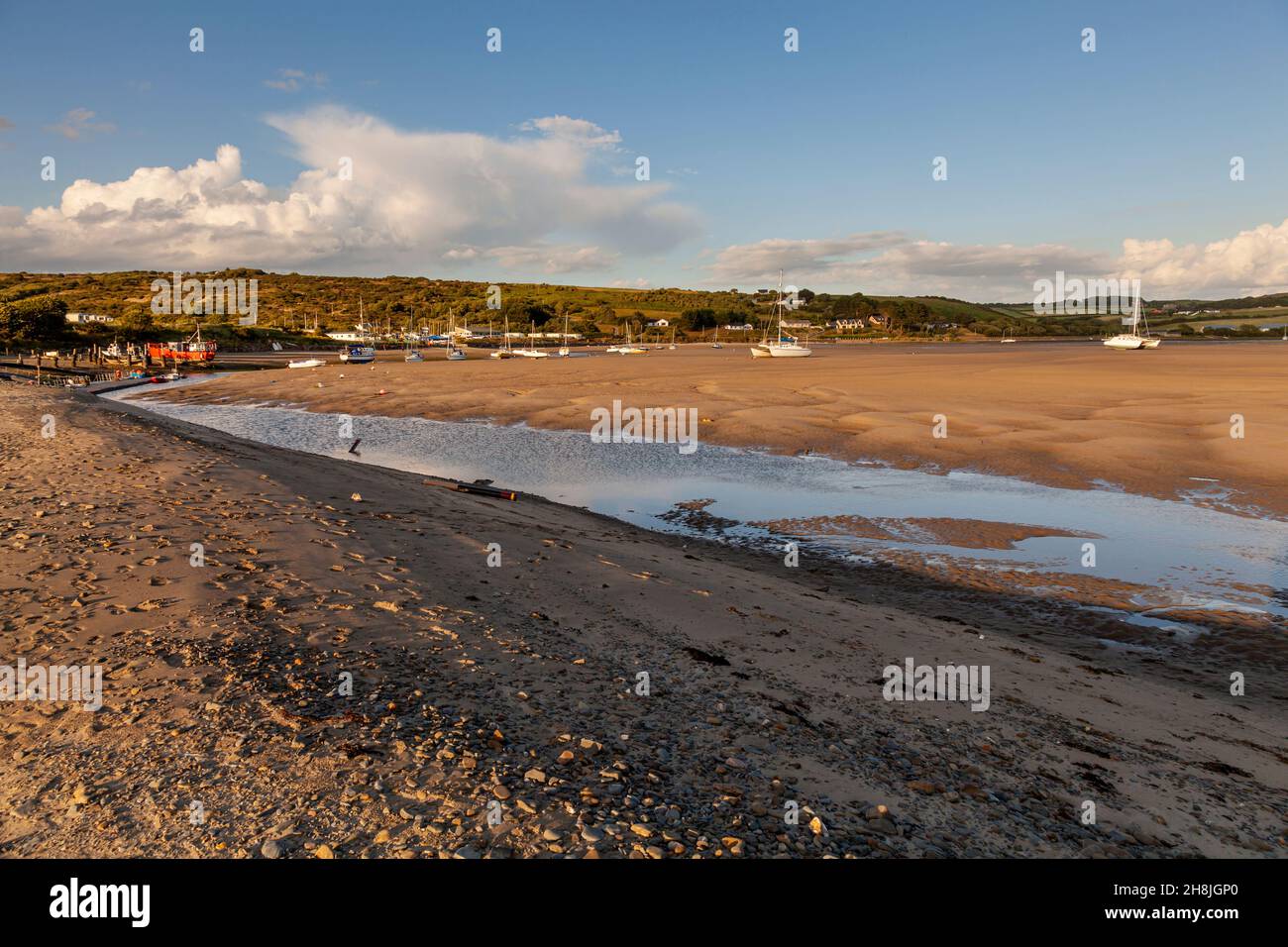 Boats lie marooned at low tide in the Teifi estuary,The Patch, Gwbert ...