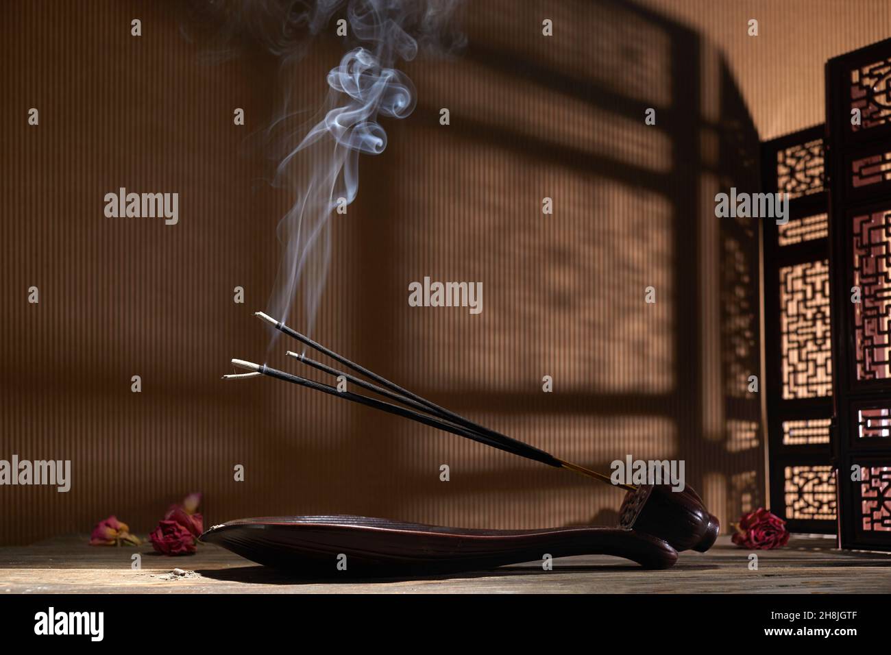 Sandalwood smoke in incense holder hi-res stock photography and images ...