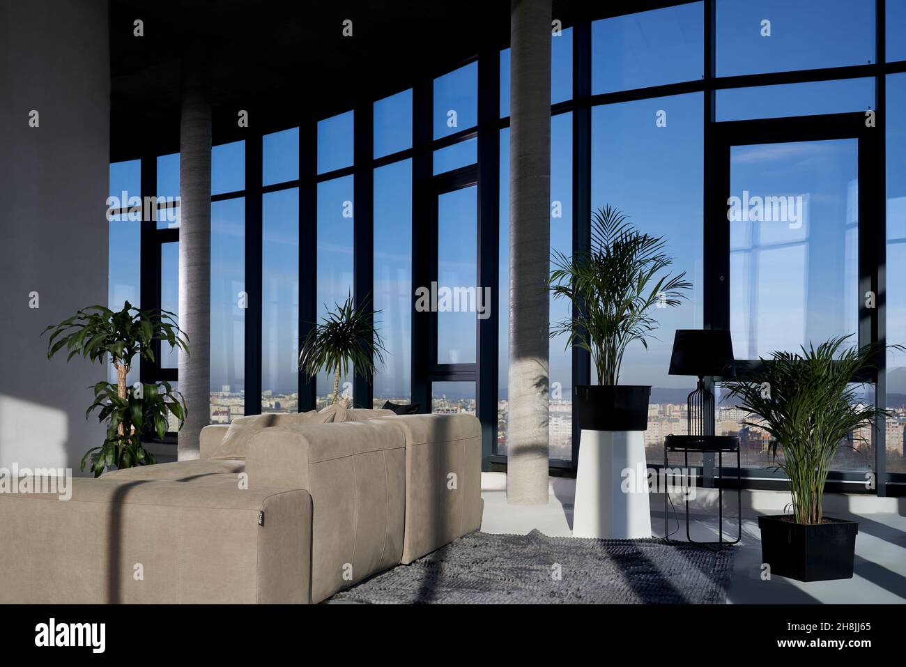 Front view of large panoramic window with incredible view on city and ...