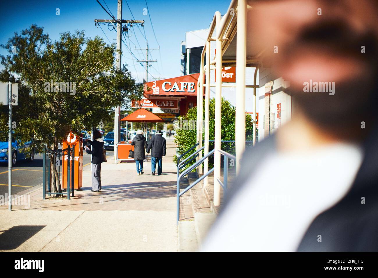 People wandering in town center Stock Photo - Alamy