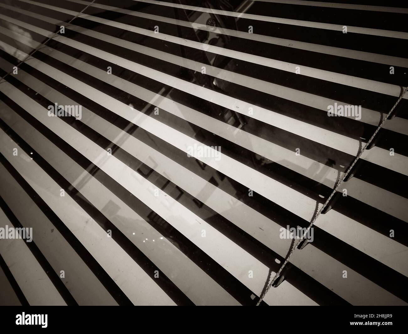 Grayscale close-up shot of half-open window blinds detail Stock Photo ...