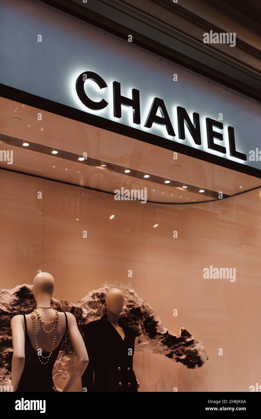 Chanel luxury shop in Moscow. Two mannequins dressed in elegant black ...