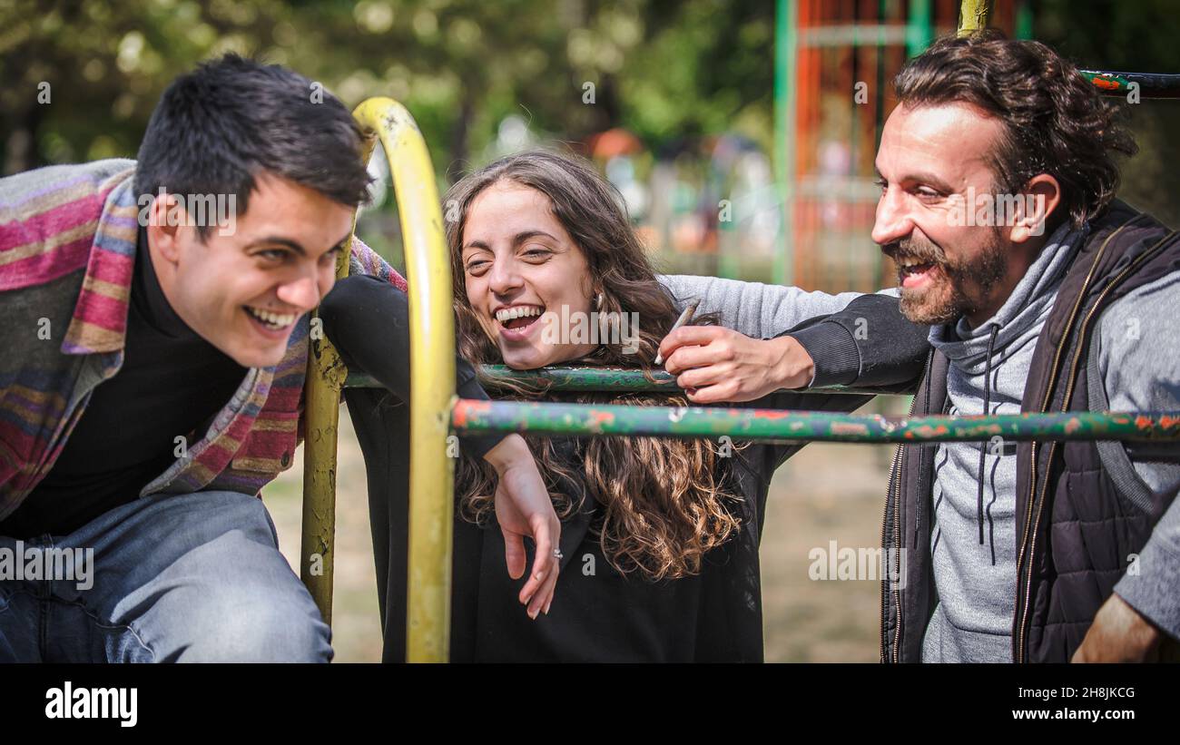 Extreme euphoria laughing. Smiling friends smoke ganja. Group of ...