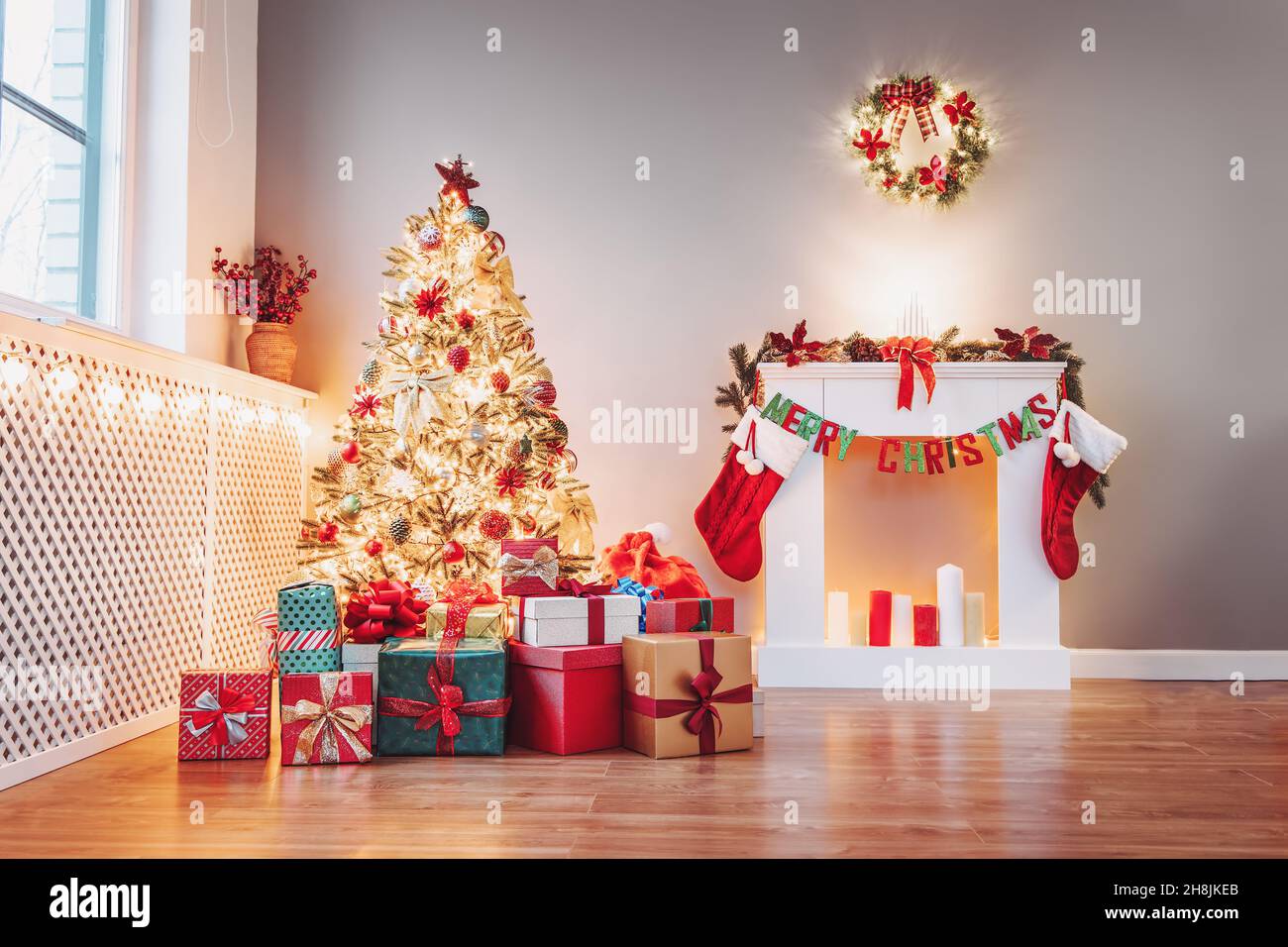 Christmas tree with gift boxes under it in the empty living room Stock ...