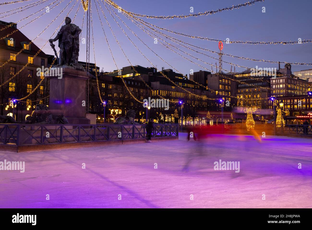 Winter in Stockholm. Ice skating in the square in Kungstradgarden ...