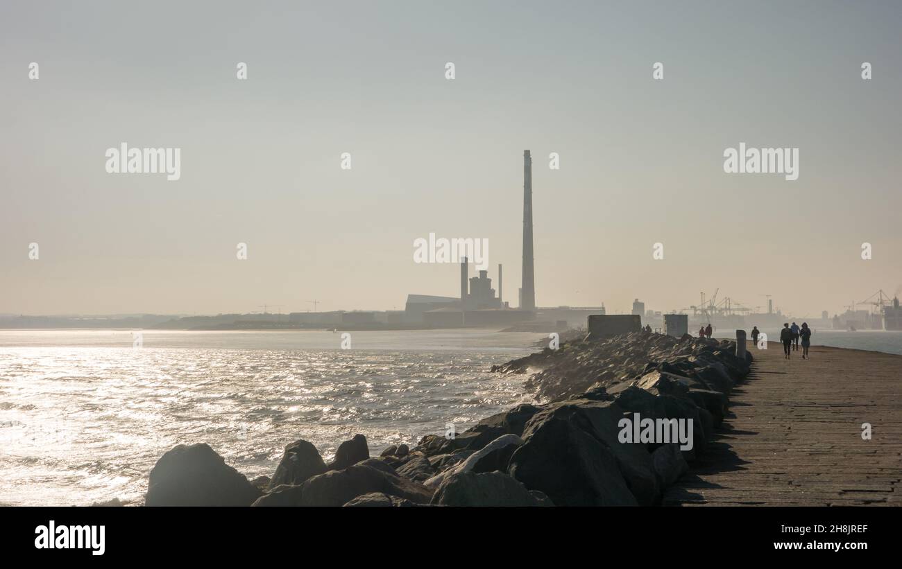 View from the Great South Wall in Dublin Bay, Ireland. The towers of ...
