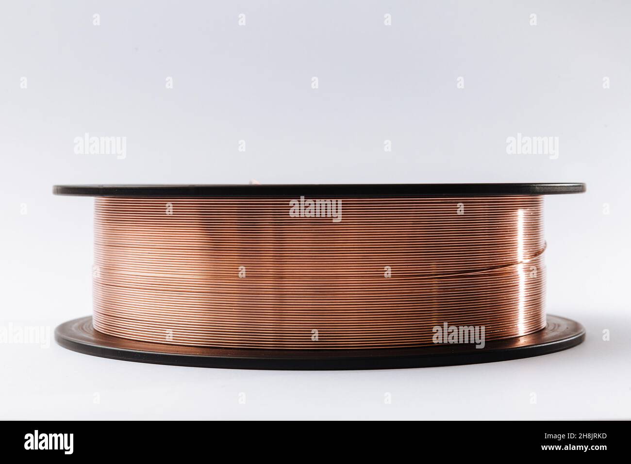 Welding wire spool on a white background Stock Photo - Alamy