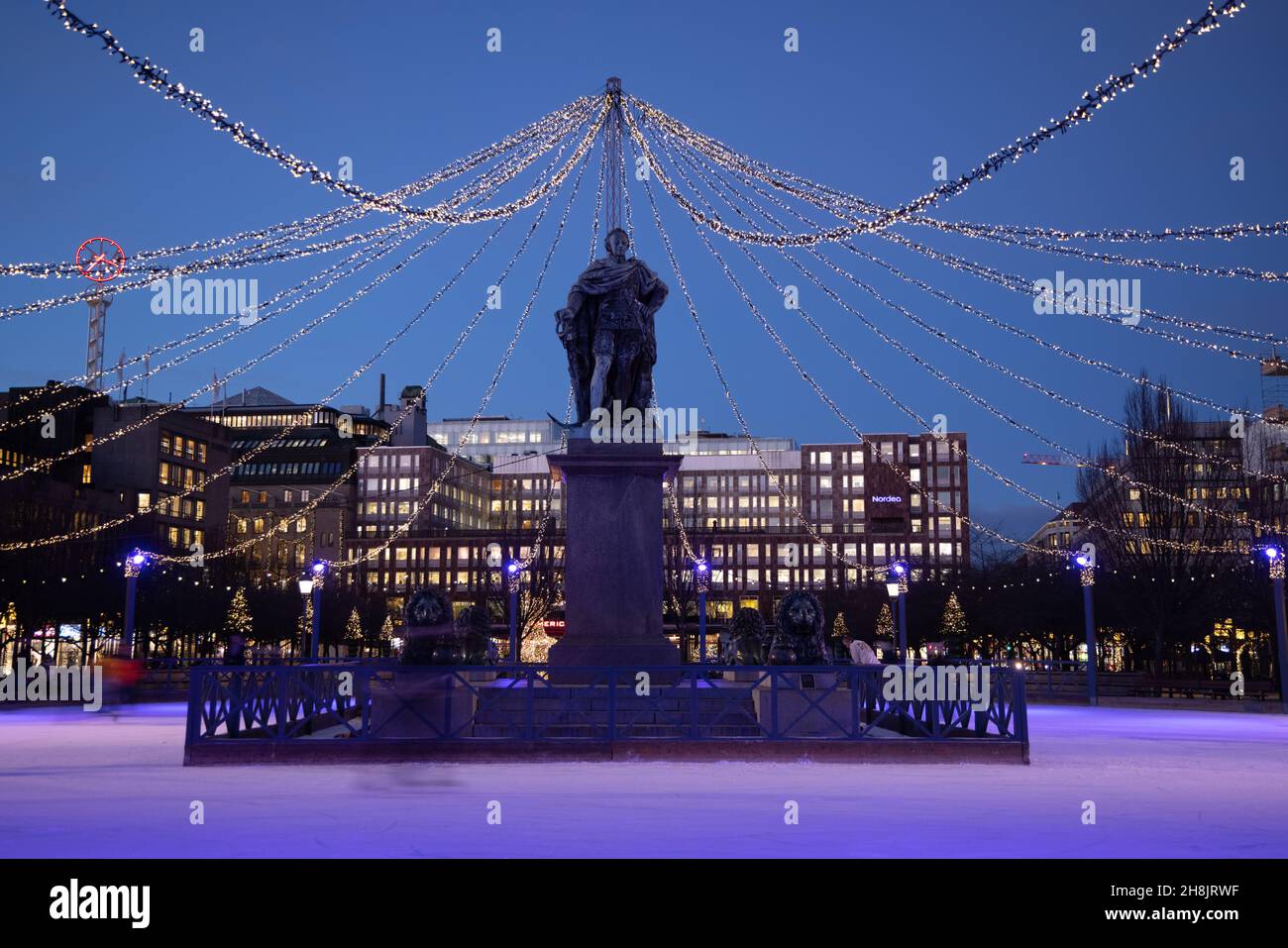 Winter in Stockholm. Ice skating in the square in Kungstradgarden ...