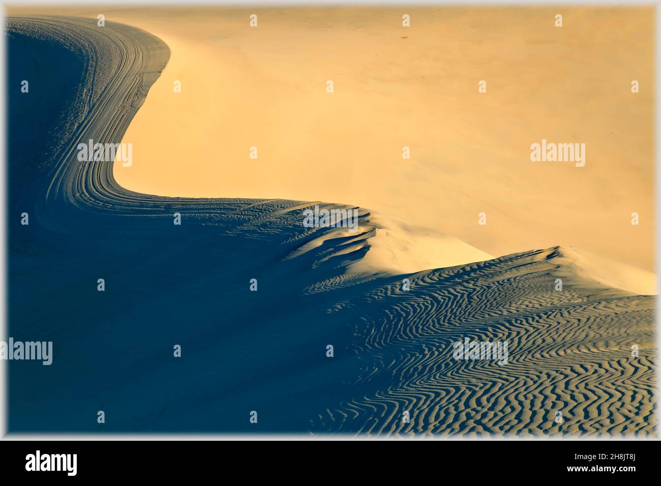 A close-up view of a sand dune, captured from a high angle with a ...