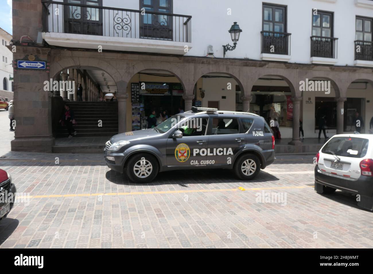 Police car in Cusco Peru badge sign grey car cars arch arches steps ...