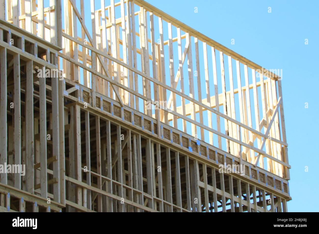 New construction with 2x4 wood boards Stock Photo - Alamy