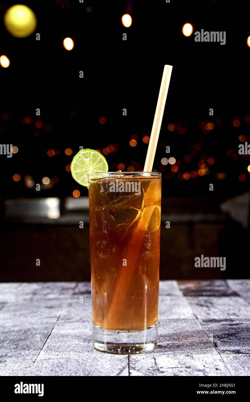 cocktail in a transparent glass with a starry black background, various ...