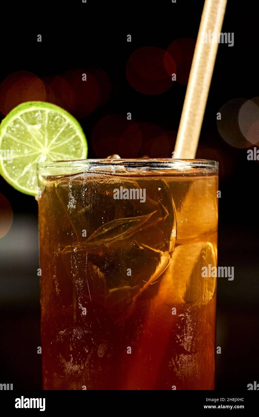 cocktail in a transparent glass with a starry black background, various ...