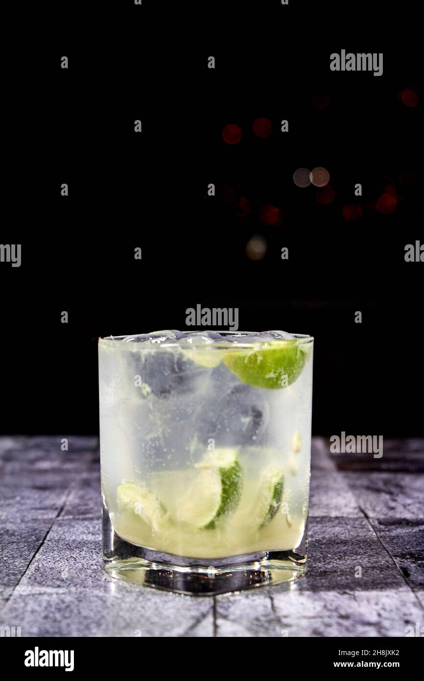 cocktail in a transparent glass with a starry black background, various ...