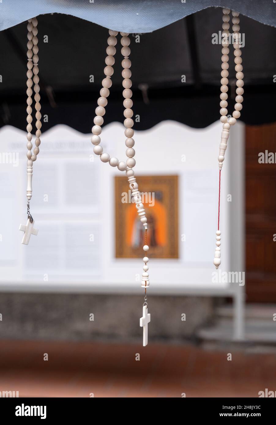 Closeup shot of cross rosary hanging Stock Photo - Alamy