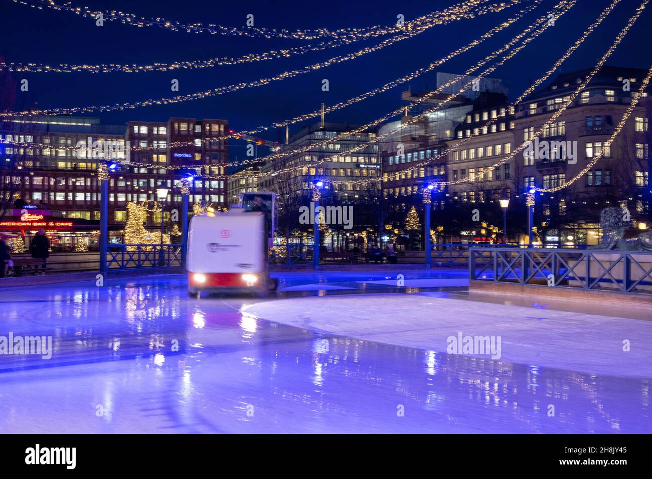 Winter in Stockholm. Ice skating in the square in Kungstradgarden ...