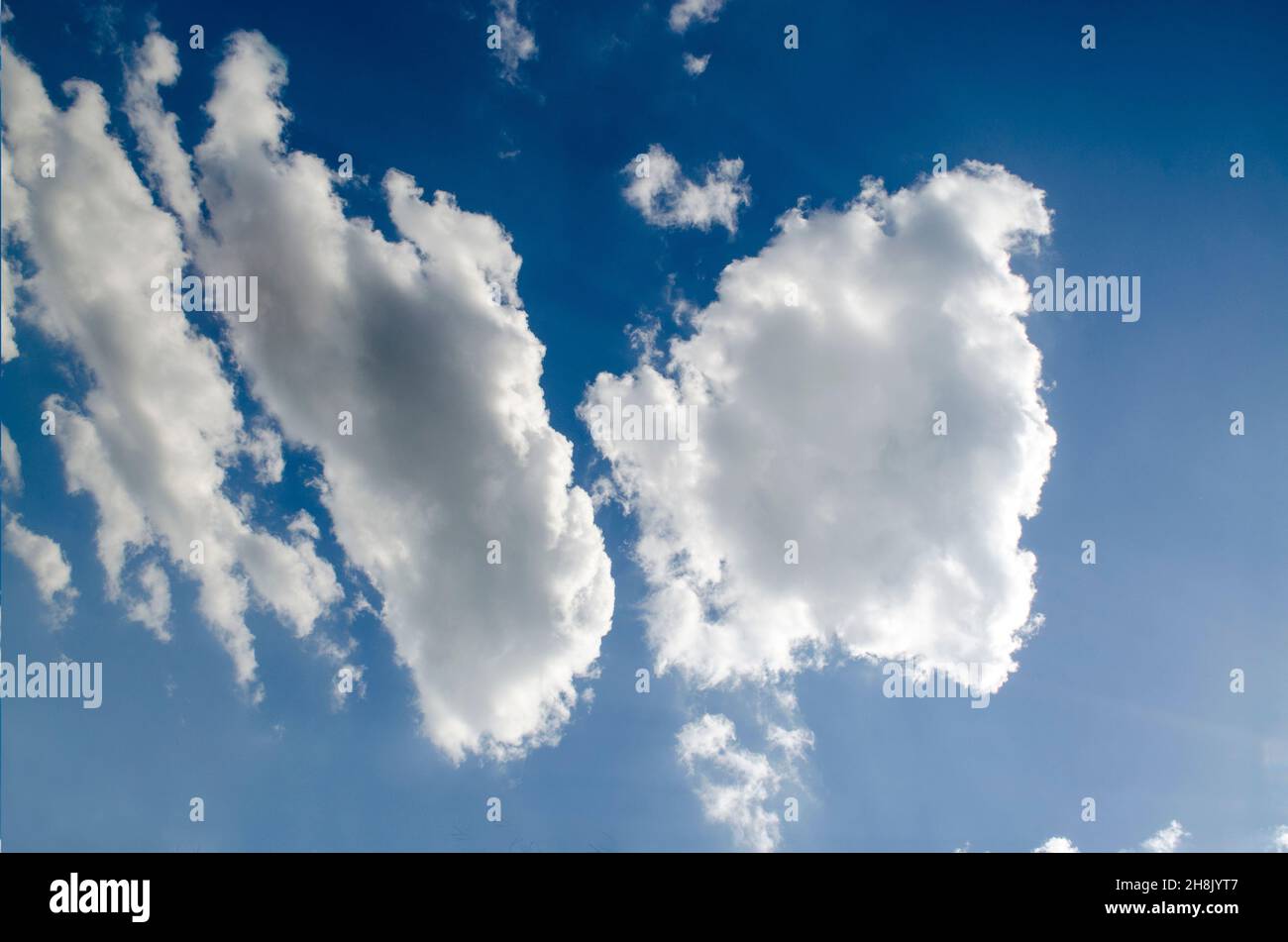 Blue sky with white clouds in sun rays, pure sky background Stock Photo ...