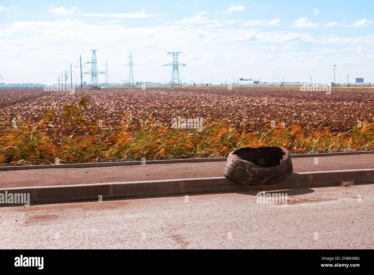 Torn rubber tire of a truck on the side of the road. Trouble on a road ...