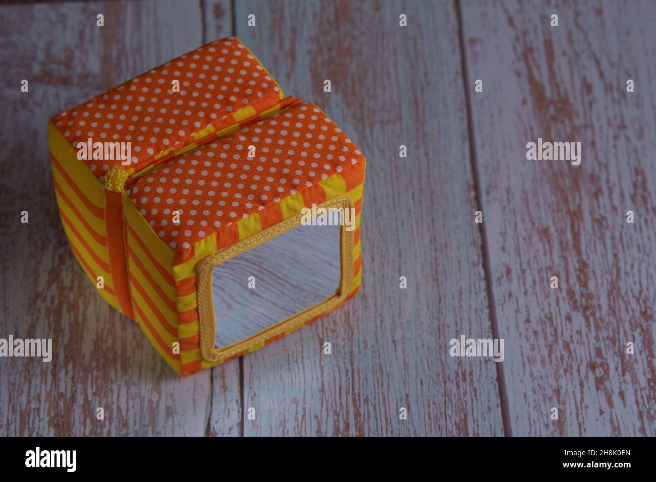 cotton baby toy in the shape of a square with mirror Stock Photo - Alamy