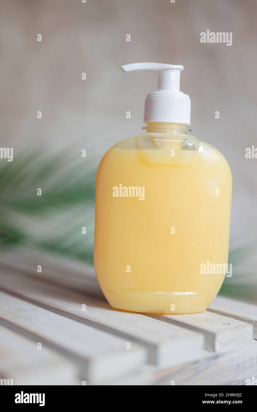 cleansing and antiseptic liquid soap with a dispenser against the ...