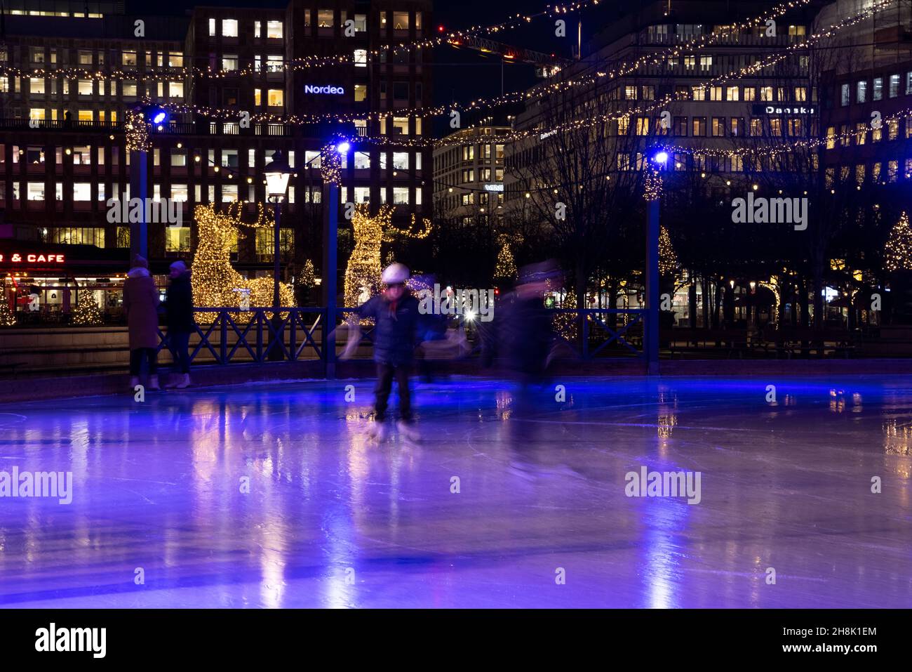 Winter in Stockholm. Ice skating in the square in Kungstradgarden Stock ...