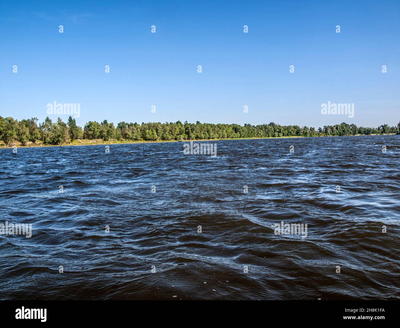 Heavy river waves rolling in a little storm Stock Photo - Alamy