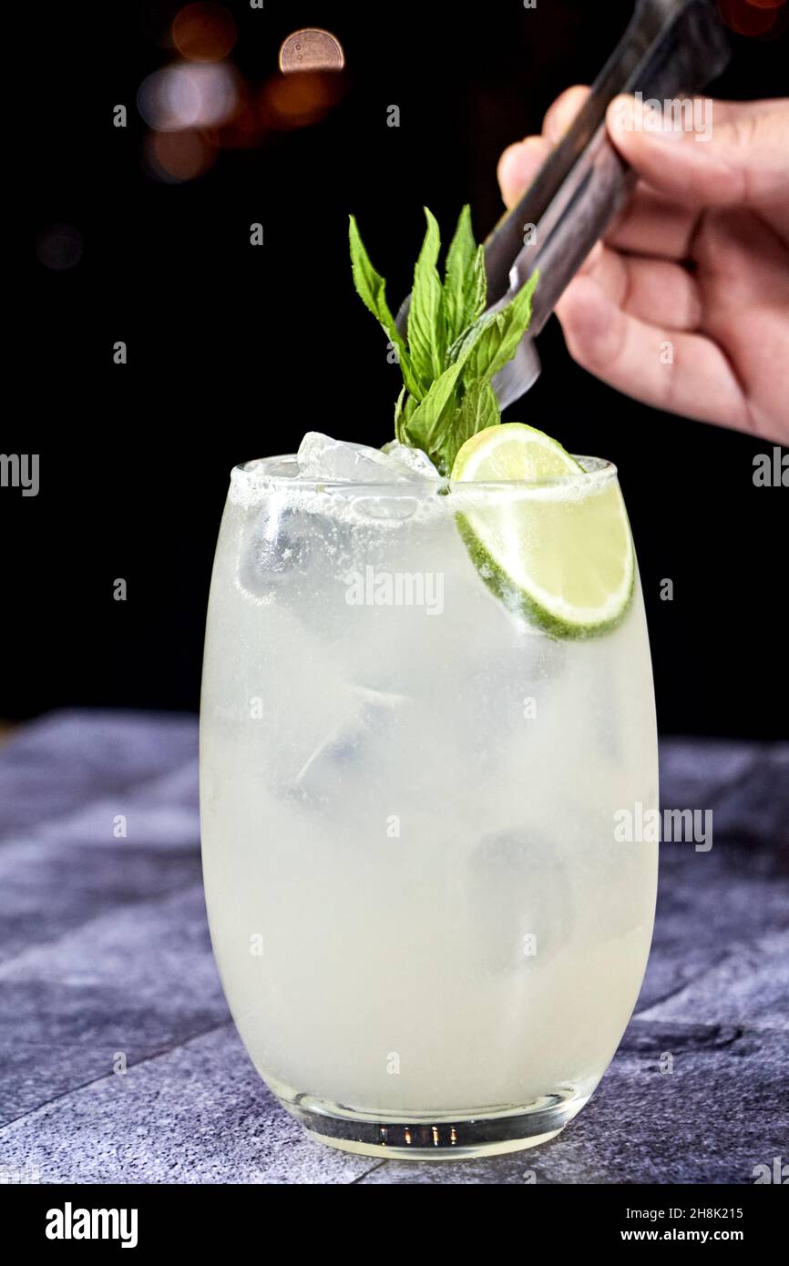cocktail in a transparent glass with a starry black background, various ...